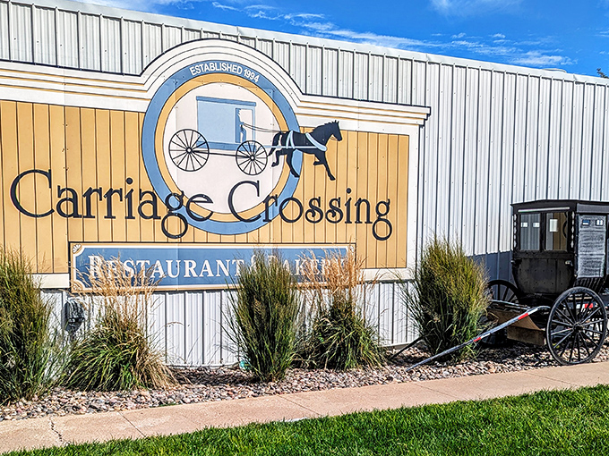 The iconic Carriage Crossing sign welcomes hungry travelers with its Amish-inspired logo&mdash;a promise of heartland hospitality waiting just beyond those doors.