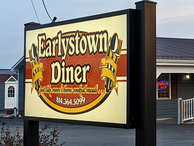 The glowing sign of Earlystown Diner promises "just like mom's home cooked meals" – a bold claim that, surprisingly, they actually deliver on.