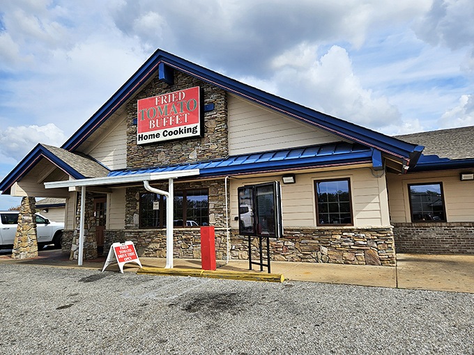The iconic red sign beckons hungry travelers like a Southern lighthouse promising comfort food salvation.
