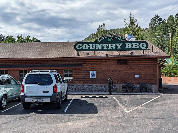 This unassuming log cabin exterior hides culinary treasures that would make any food detective's case file. The smoking gun? That BBQ sign.
