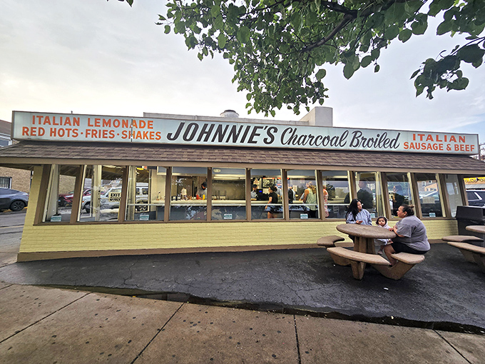 The humble temple of beef worship glows like a beacon in the night, promising salvation in sandwich form to all who make the pilgrimage.