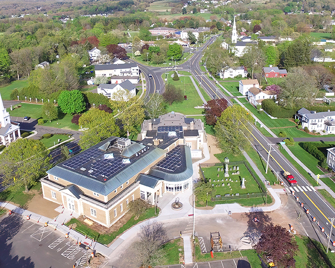 Ellington's town center from above &ndash; where New England charm meets modern convenience, complete with solar panels that say "we're traditional, but not stuck in the past."