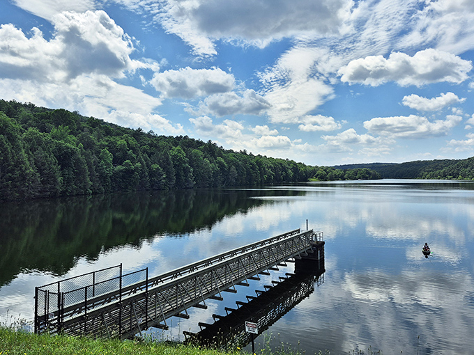 Mirror, mirror on the lake &ndash; Holman Lake's glass-like surface perfectly captures Pennsylvania's summer sky in a breathtaking natural selfie.