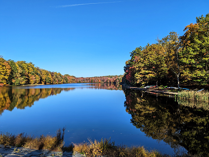 Fall foliage creates a perfect symmetry of color on Hopewell Lake. The kind of view that makes smartphone cameras feel wholly inadequate.