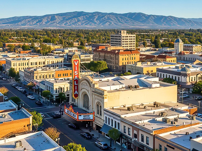 The iconic Visalia Fox Theatre marquee stands as a beacon of entertainment against the backdrop of Sierra Nevada mountains &ndash; small-town charm with a cinematic flair.