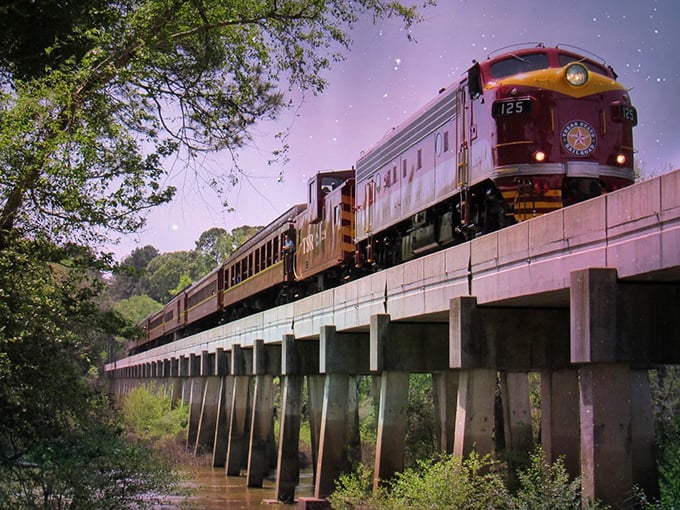 Twilight magic transforms an ordinary diesel engine into something from a storybook as it glides across the historic trestle bridge.