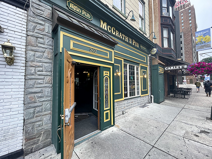 The emerald facade of McGrath's Pub stands like a Celtic beacon on Harrisburg's Locust Street, promising authentic Irish hospitality behind that wooden door.