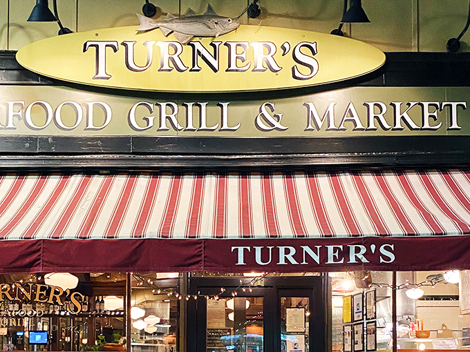 That red and white striped awning isn't just decoration – it's a beacon calling you home to serious seafood.