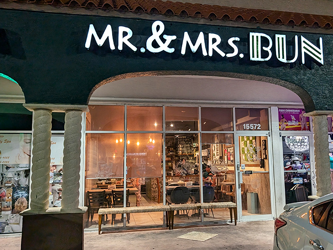 The neon sign beckons like a lighthouse for hungry souls. This unassuming strip mall storefront houses Miami's Peruvian sandwich paradise.