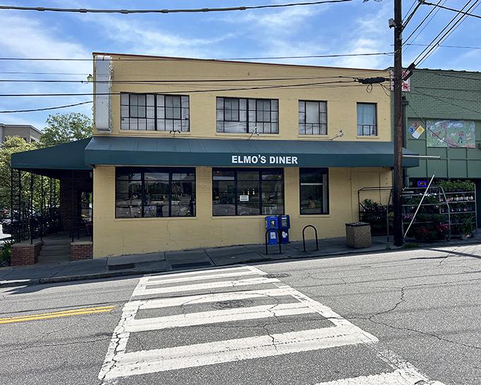 The unassuming yellow brick exterior of Elmo's Diner stands like a beacon of breakfast hope on Durham's Ninth Street, promising comfort food salvation inside.