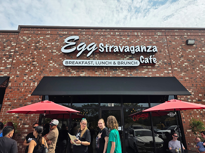 The brick exterior of Eggstravaganza Cafe stands like a breakfast beacon in Antioch, with those cheerful red umbrellas practically winking at hungry passersby.