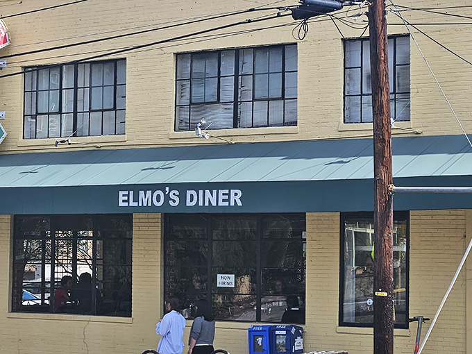 The iconic yellow exterior of Elmo's Diner stands as Durham's breakfast beacon, promising comfort food that's worth getting out of bed for.