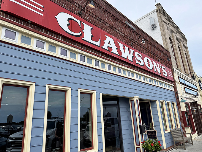 The striking blue facade with crisp white trim stands out on Front Street like a postcard from coastal Carolina come to life.