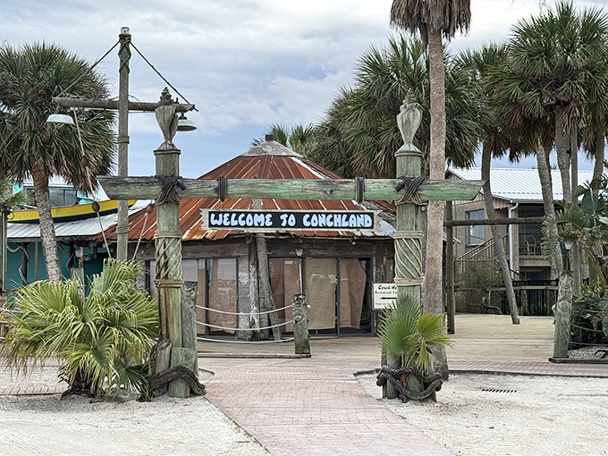 The weathered "Welcome to Conchland" sign promises the kind of authentic Florida experience that no theme park could ever replicate.