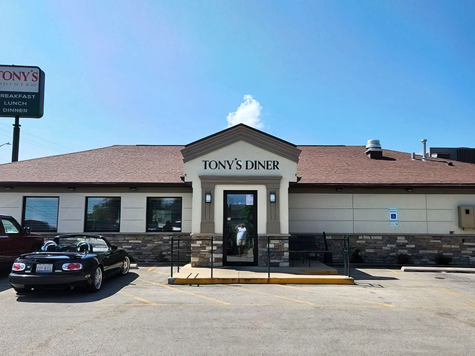 Morning sunshine bathes Tony's Diner in golden light, as if the breakfast gods themselves are highlighting your next delicious destination. The convertible in the lot suggests someone's day is already looking up.