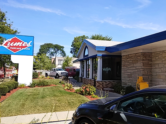 The iconic red diamond sign of Lumes Pancake House stands as a breakfast beacon, promising morning salvation to hungry Chicagoans.