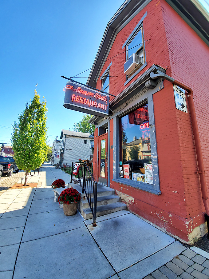 The iconic red brick exterior of Sam and Ethel's stands like a breakfast beacon on Tipp City's Main Street, complete with vintage signage that's been guiding hungry locals for generations.