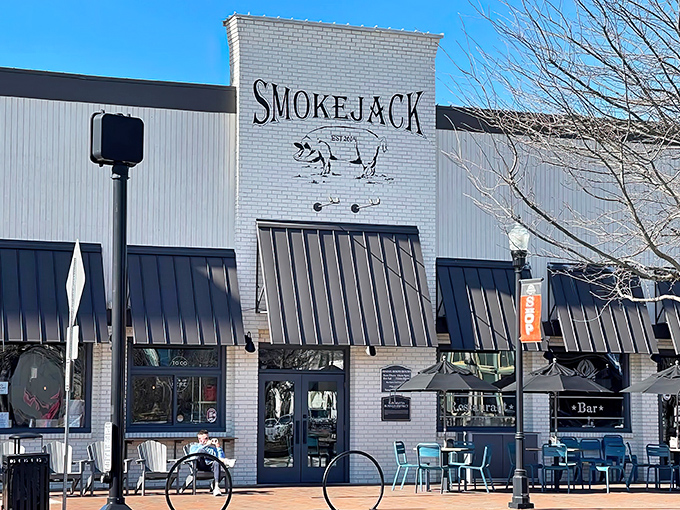 The white brick fa&ccedil;ade of Smokejack BBQ stands proud in downtown Alpharetta, its pig logo promising smoky delights within. The black awnings add a touch of sophistication to this temple of meat.