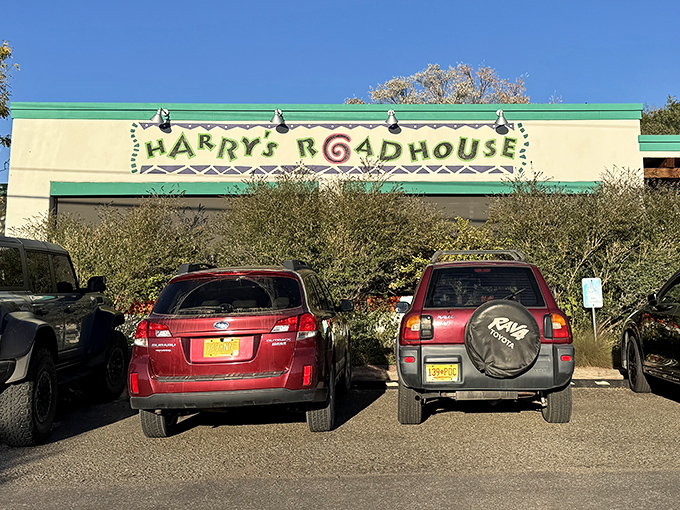 The turquoise-trimmed facade of Harry's Roadhouse beckons like a desert oasis, promising culinary treasures beyond those humble cream-colored walls.