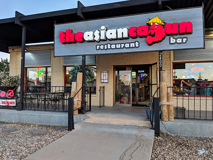 The Asian Cajun&rsquo;s bold red crab and playful signage hint at the fusion feast inside &mdash; a culinary treasure hiding in plain sight.