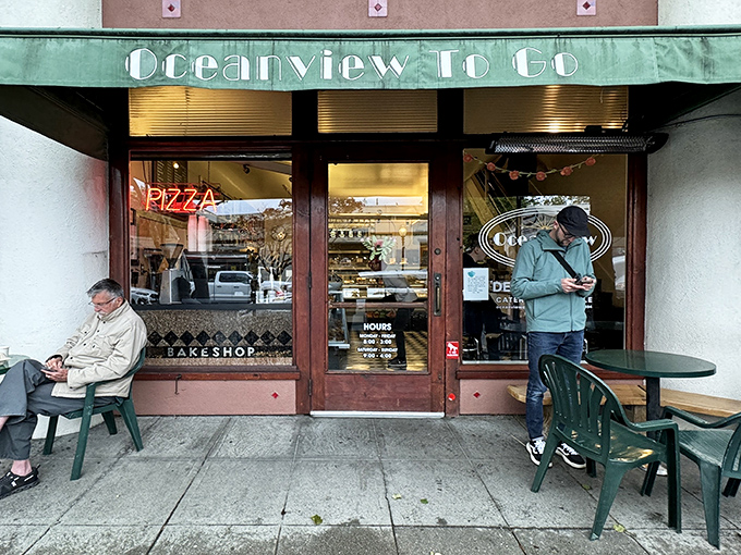 The green awning and neon sign beckon like an old friend waving you over. Berkeley's Oceanview Diner promises comfort before you even step inside.