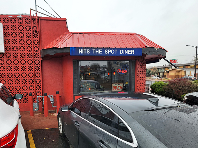 Rain or shine, the distinctive coral-colored exterior with its geometric brick pattern promises comfort food that lives up to the diner's confident name.