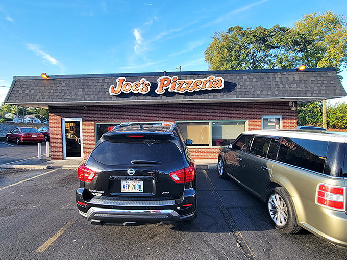 That unassuming brick exterior hides decades of pizza perfection inside, proving great things come in humble packages.