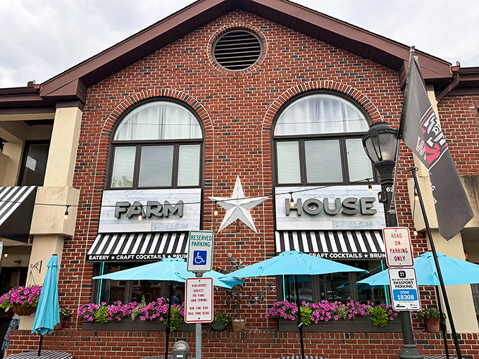 The brick facade of Farmhouse Crystal stands proudly in East Stroudsburg, its star emblem and blue umbrellas beckoning hungry travelers like a culinary lighthouse.