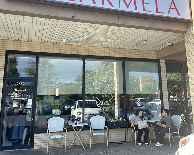 The unassuming storefront of Cafe Carmela beckons with a simple promise: inside these walls, Italian magic happens daily.