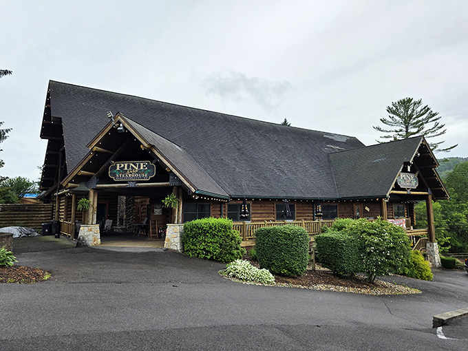 The ultimate mountain retreat awaits! Pine Lodge Steakhouse's timber frame exterior promises rustic luxury and culinary delights inside those log cabin walls.