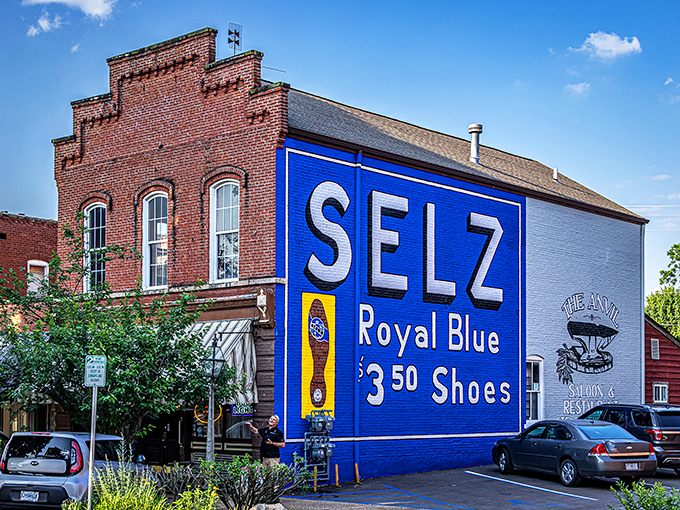 History meets hunger at the Anvil, where that vintage blue Selz Shoes advertisement might be the second most photographed thing—right after your perfectly seared steak.