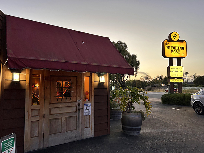 The burgundy awning and rustic wooden entrance beckon like an old friend at dusk. This isn't just dinner&mdash;it's a California pilgrimage worth every mile.