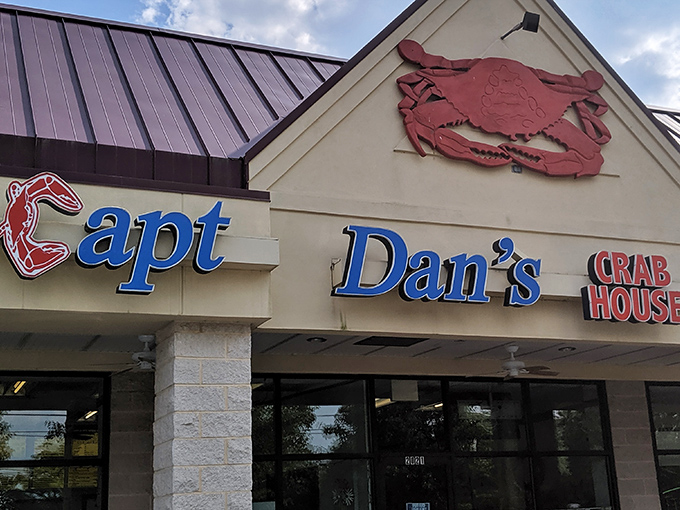 The iconic red crab perched atop Captain Dan's Crabhouse isn't just decoration&mdash;it's a promise of seafood nirvana waiting inside.