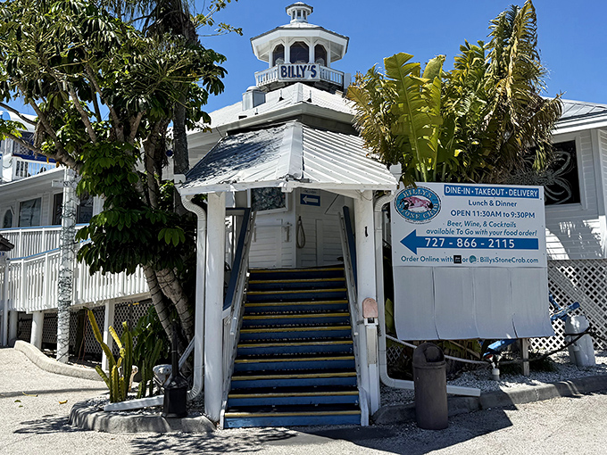 The blue stairway to seafood heaven beckons visitors upward, promising delicious treasures at the summit of Billy's Stone Crab.