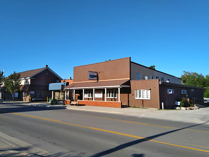 The unassuming exterior of Steis's Village Inn stands proudly on Lexington's main street, a beacon for hungry travelers seeking authentic Michigan comfort food.