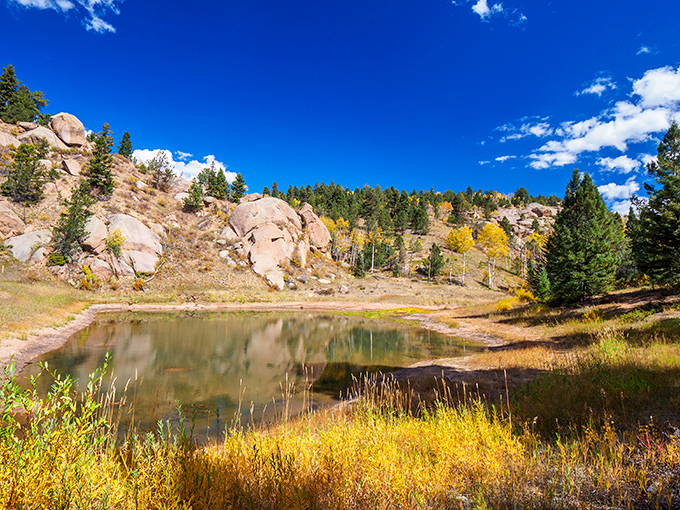 Where earth meets sky in perfect harmony &ndash; Mueller's pristine ponds reflect Colorado's impossibly blue heavens and sun-kissed rock formations.
