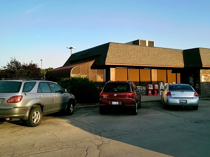 Johnny Pamcakes welcomes early birds and night owls alike with its classic diner silhouette against the Illinois sky. Breakfast paradise awaits!