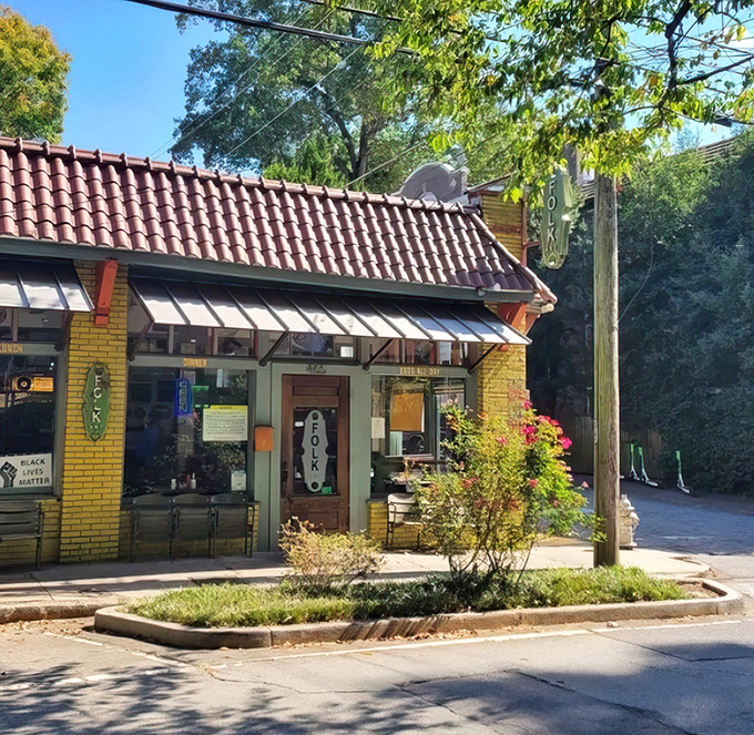 Bathed in golden sunlight, Folk Art's cheerful yellow exterior and vintage signage promise the kind of morning meal worth setting your alarm for.