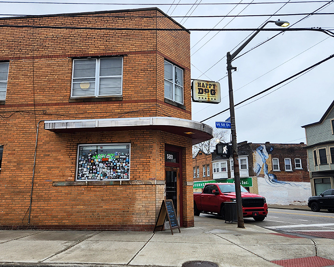 Happy Dog's vintage sign beckons hungry travelers like a yellow beacon of hope in a world of boring lunch options.