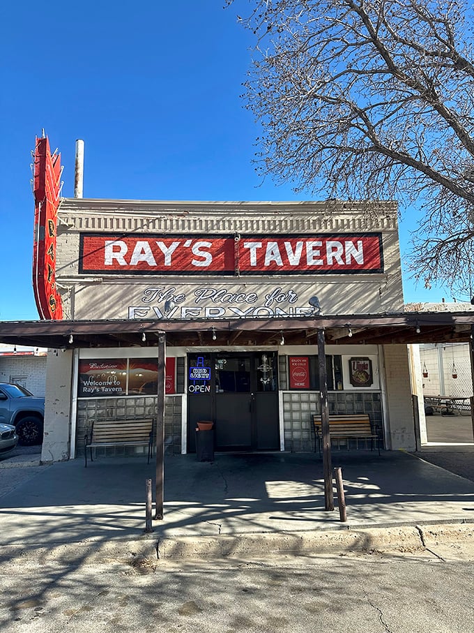 The iconic red neon sign of Ray's Tavern stands proudly against the Utah sky, beckoning hungry travelers like a desert lighthouse for the famished.