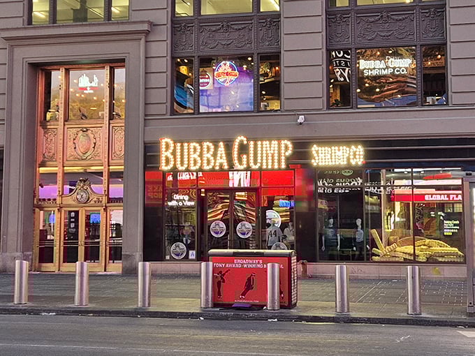 The iconic yellow glow of Bubba Gump's Times Square location beckons like a lighthouse for seafood lovers amid Manhattan's concrete ocean.