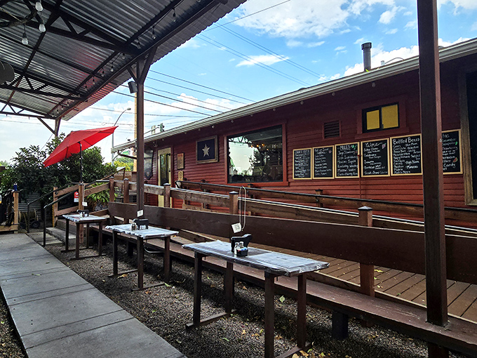 The rustic outdoor seating area at Joey's BBQ welcomes you with simple wooden tables and a promise of Texas-style feasting ahead.