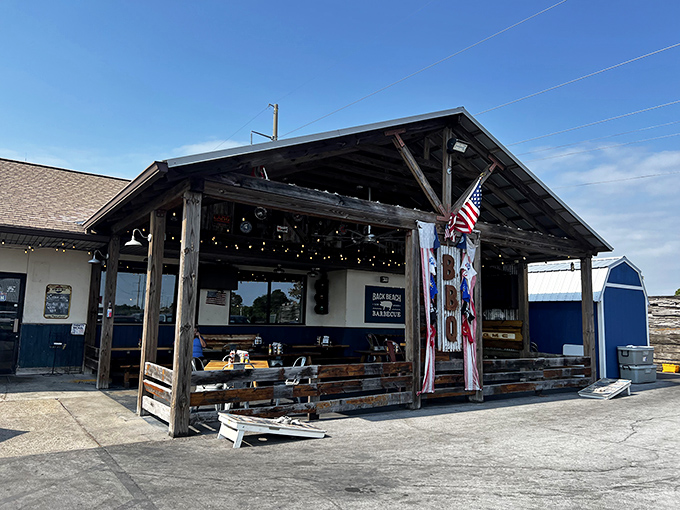 A slice of barbecue heaven under Florida skies, where the covered porch practically whispers "come sit a spell" to hungry passersby.