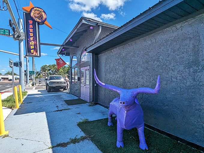 The purple bull standing guard outside isn't subtle, but neither is the flavor bomb waiting for you inside this Tampa BBQ landmark.