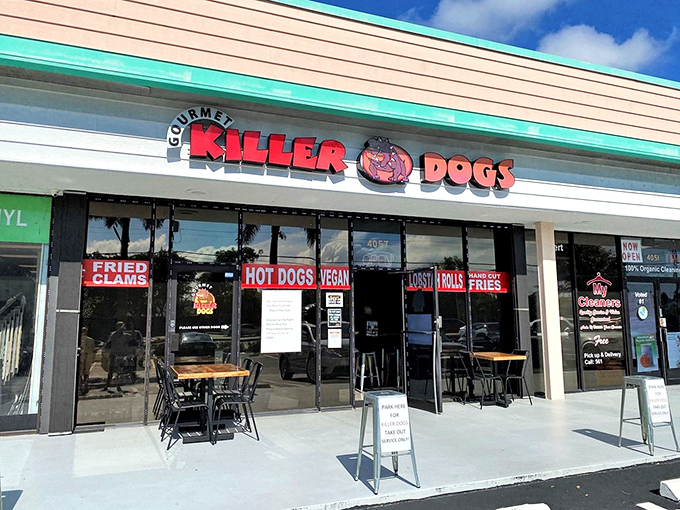 The unassuming storefront of Gourmet Killer Dogs in Delray Beach promises big flavors with its bold signage. Sometimes the best culinary treasures hide in plain sight.