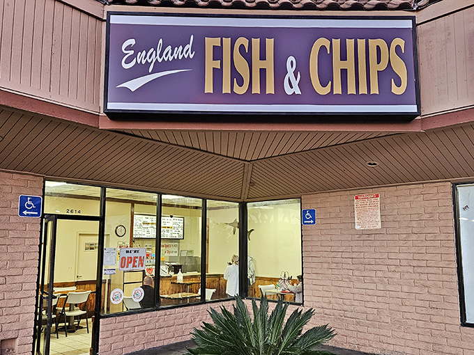 The purple and gold sign beckons like a British bat signal to fried fish aficionados. No cape required, just an appetite for crispy perfection.