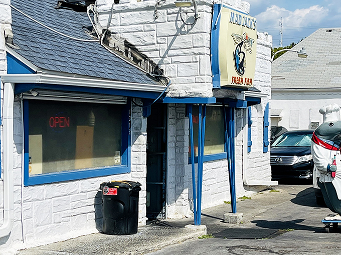 The unassuming white building with blue trim might not scream "seafood paradise," but locals know better. Mad Jack's modest exterior hides culinary treasures within.