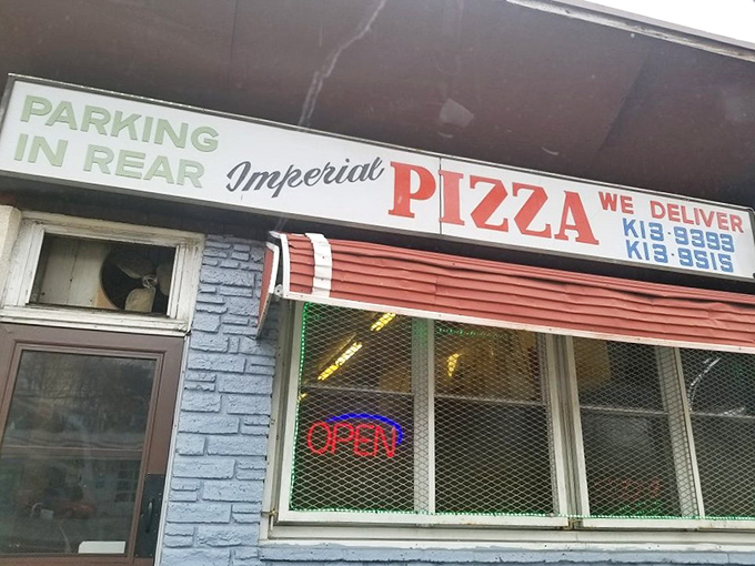 The blue-bricked facade of Imperial Pizza stands as a DelCo landmark, its vintage sign promising simple pleasures that locals swear by.