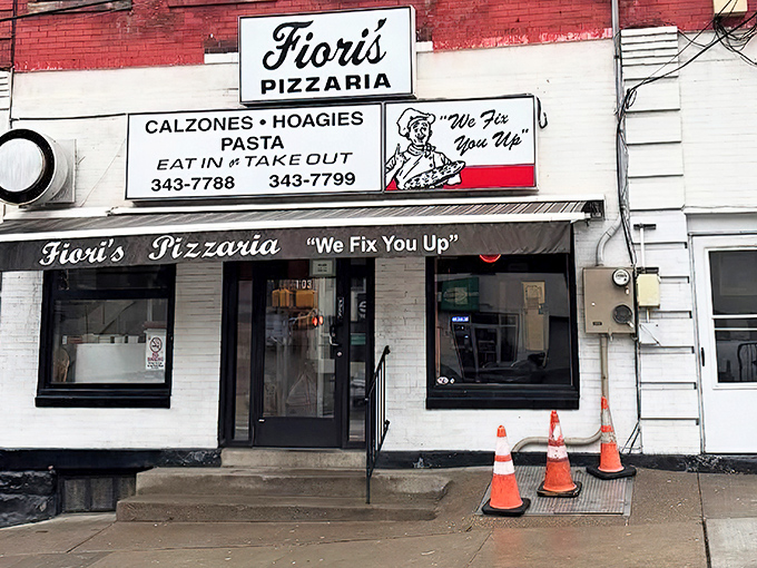 The unassuming storefront that launches a thousand pizza pilgrimages. "We Fix You Up" isn't just a slogan&mdash;it's a solemn promise to your taste buds. 
