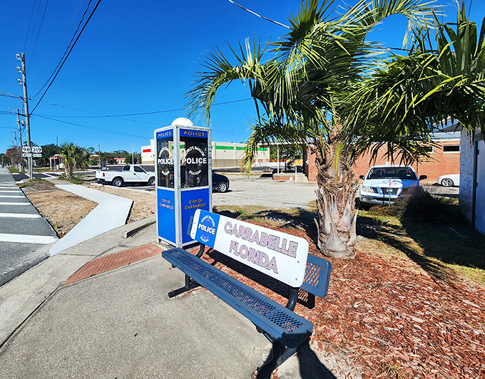 The iconic blue and white phone booth stands proudly on the corner, proving that in Carrabelle, law enforcement thinks inside the box.